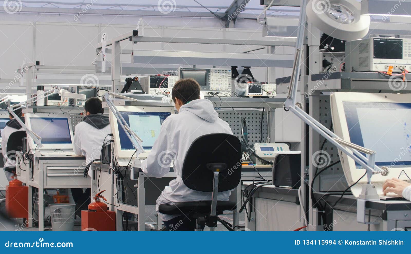 Electronics Engineers in White Clothes Working in Lab. Engineers ...