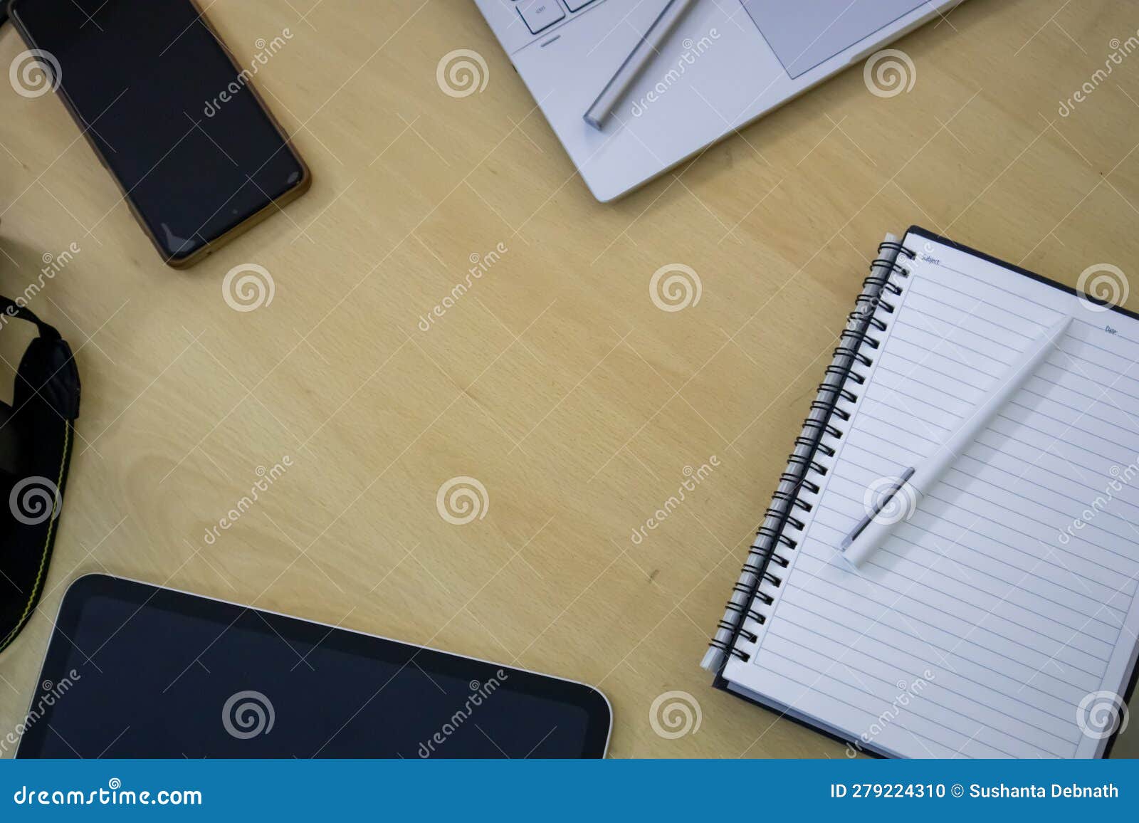 Electronics Items on a Table, Tablet, Laptop, Pencil, Pen and a Note ...