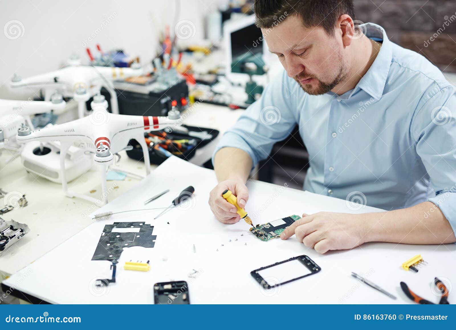 Electronics Prodigy Assembling High Tech Devices Stock Photo - Image of ...