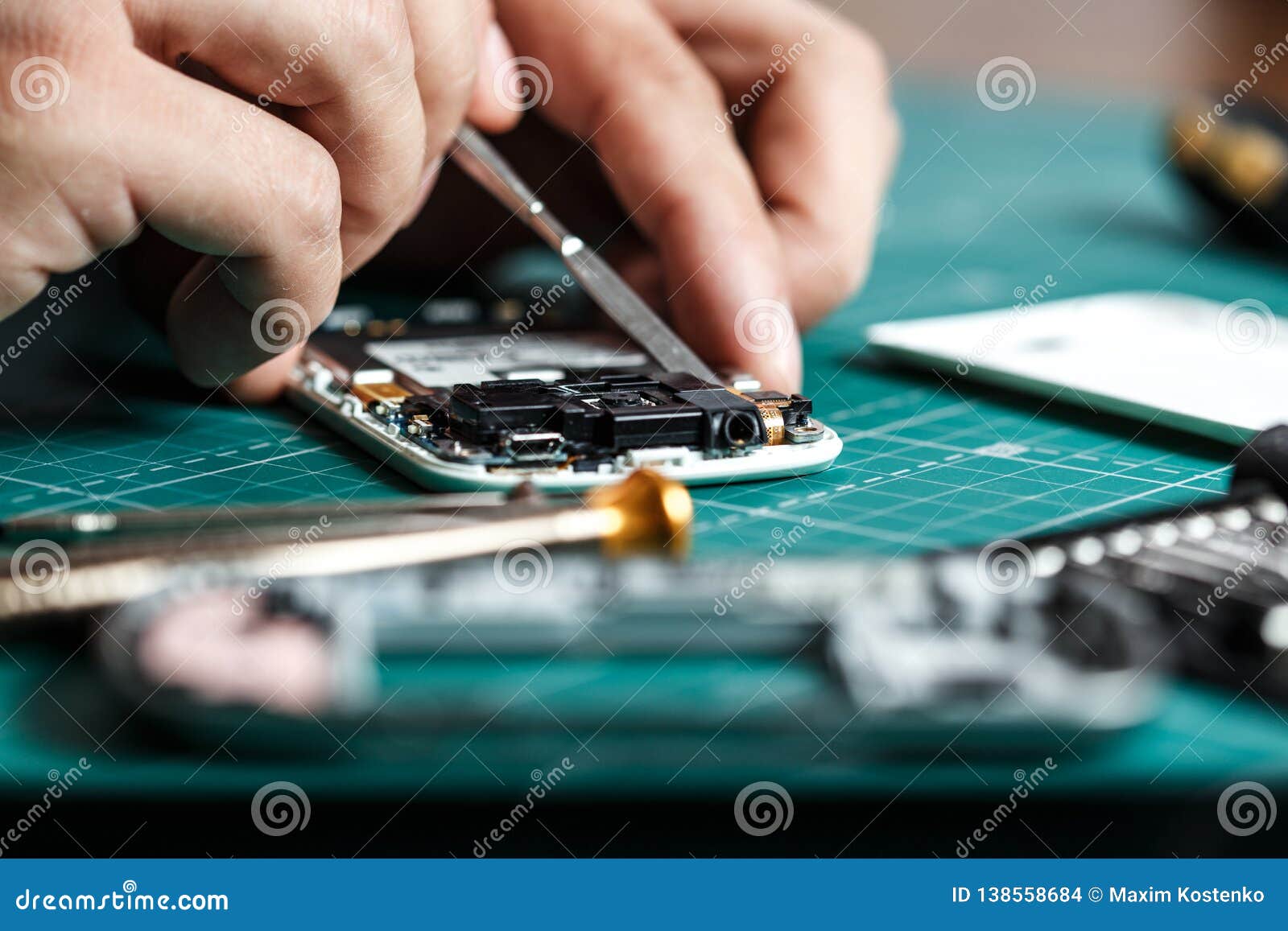 Electronics Repair Service. Technician Disassembling Smartphone for ...