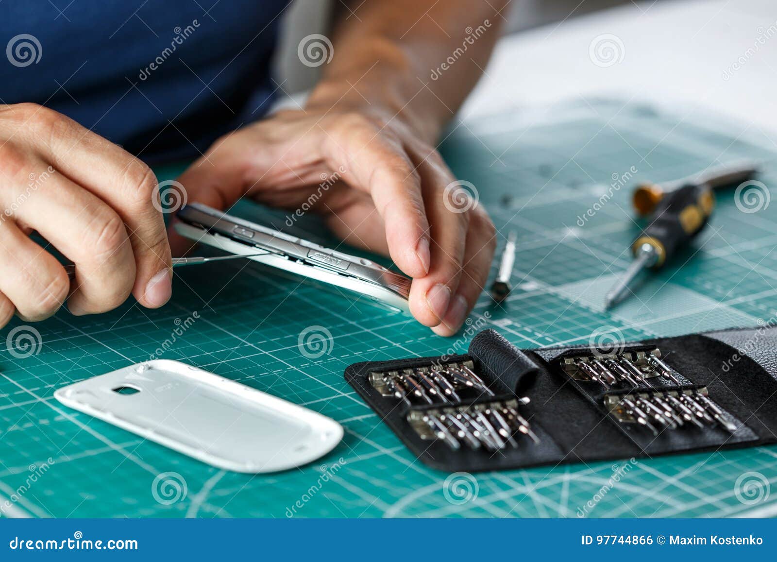 Electronics Repair Service. Technician Disassembling Smartphone for ...