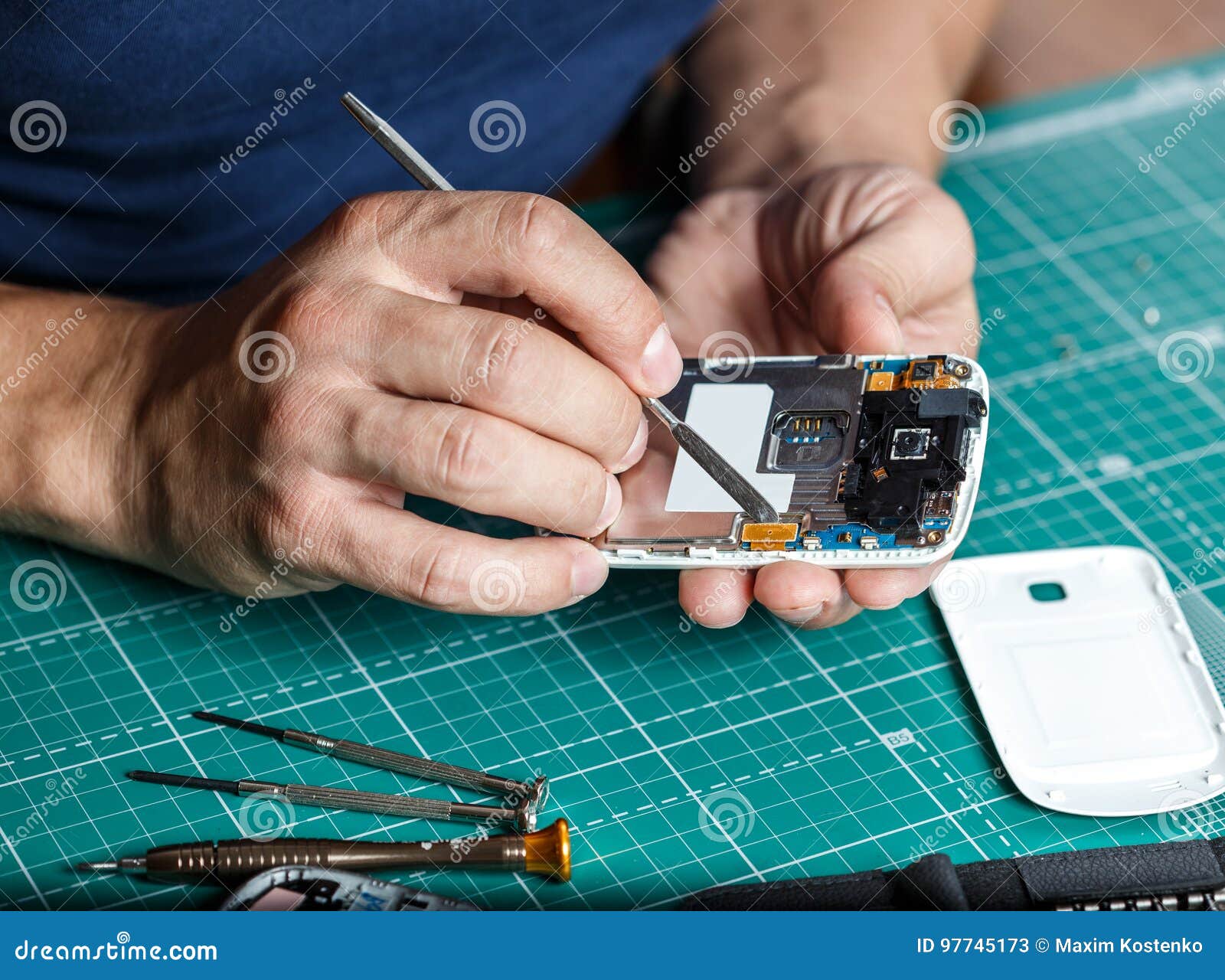 Electronics Repair Service. Technician Disassembling Smartphone for ...