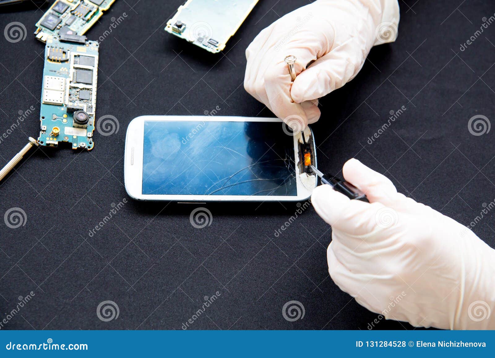 Electronics Repair Service - Technician is Fixing Broken Cell Phone ...