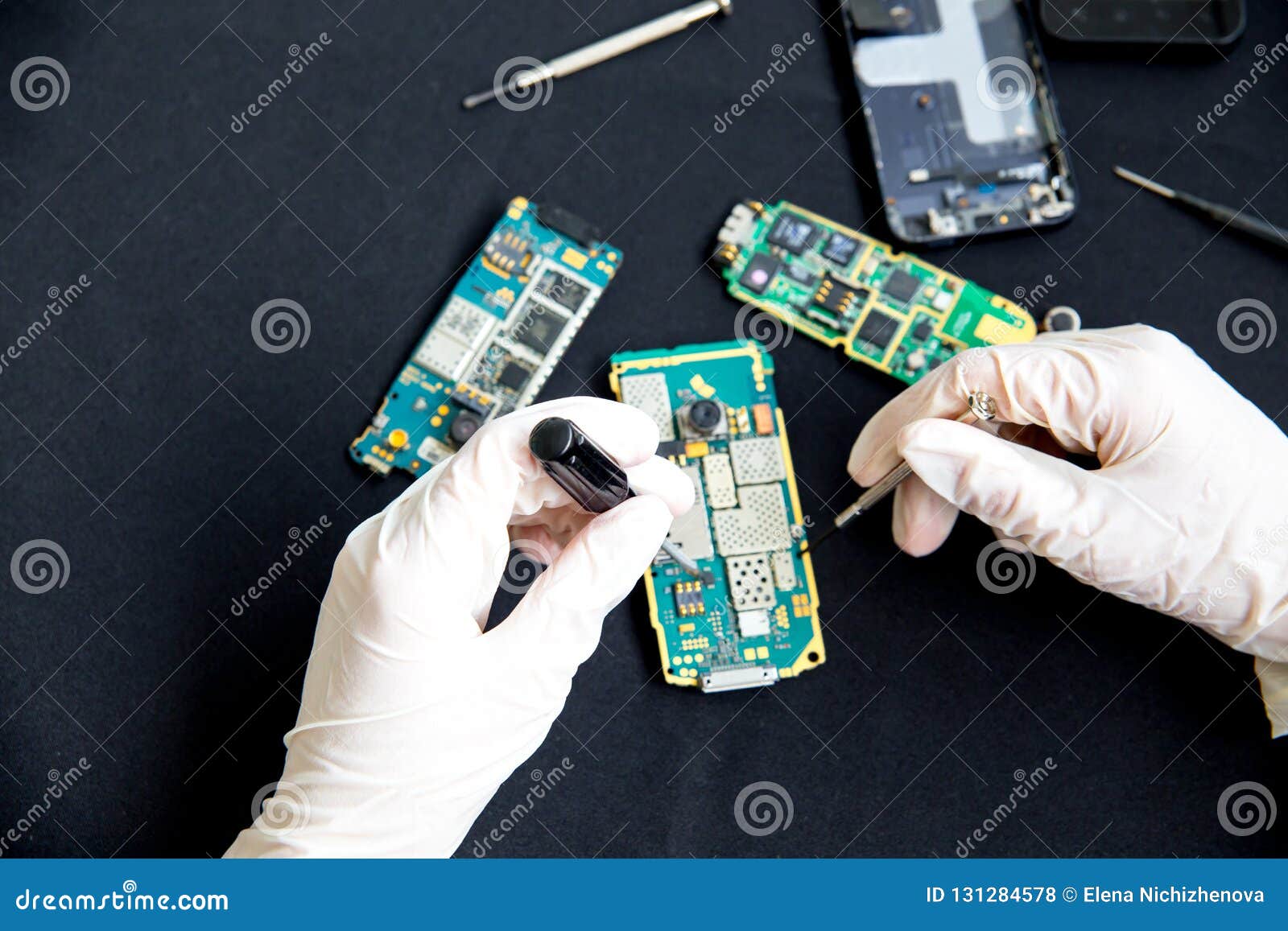 Electronics Repair Service - Technician is Fixing Broken Cell Phone ...