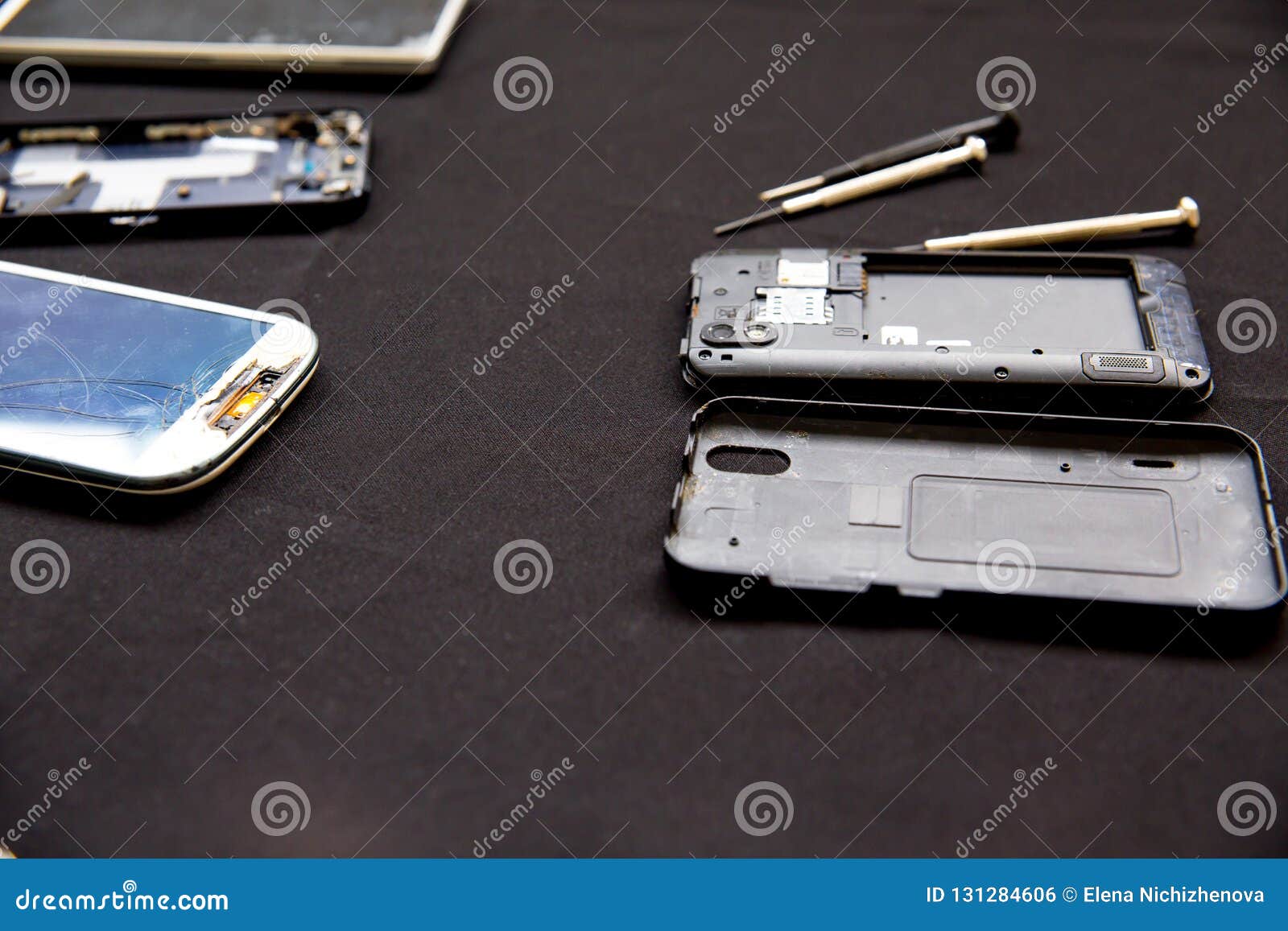 Electronics Repair Service - Technician is Fixing Broken Cell Phone ...