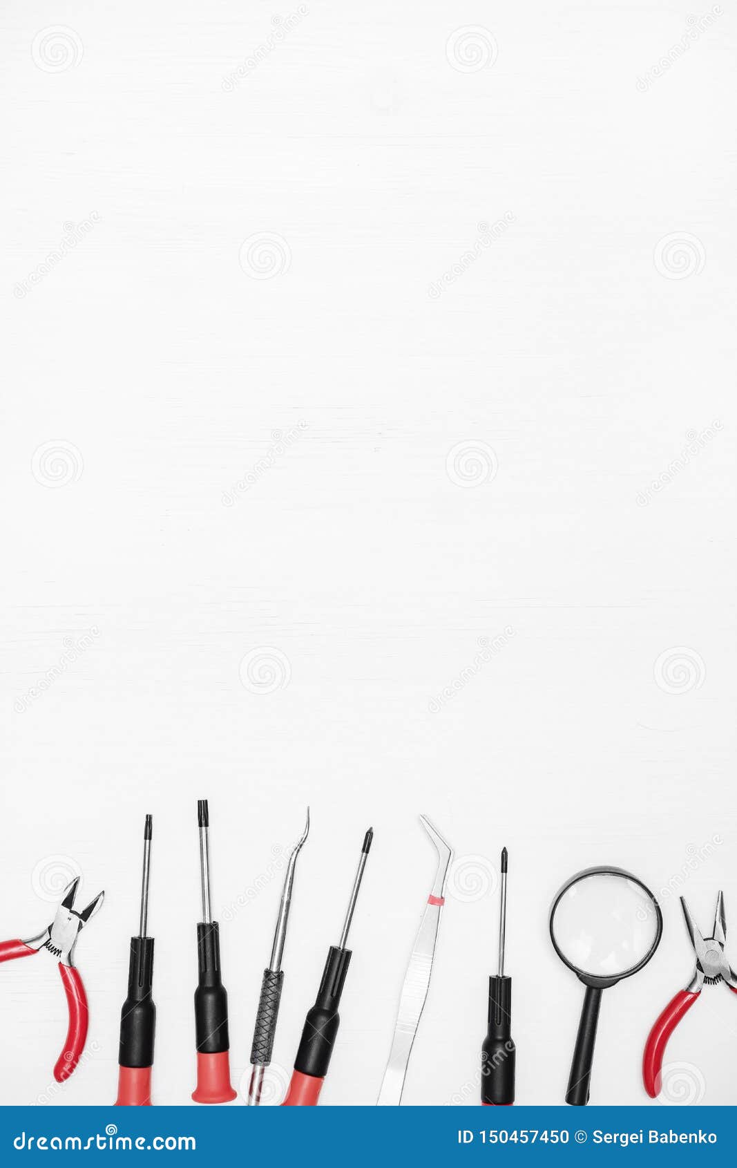 Electronics Repair Tools are Lined in a Row at the Bottom of the White ...