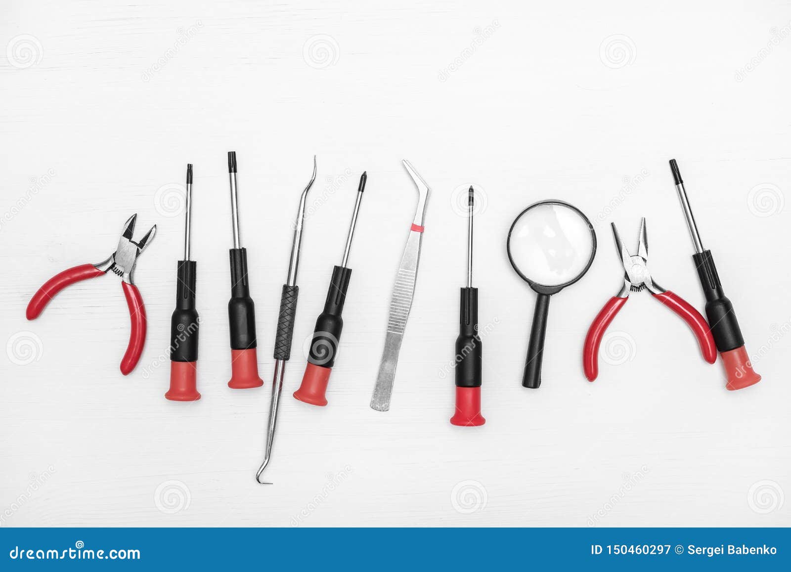 Electronics Repair Tools are Lined in a Row in the Center White ...