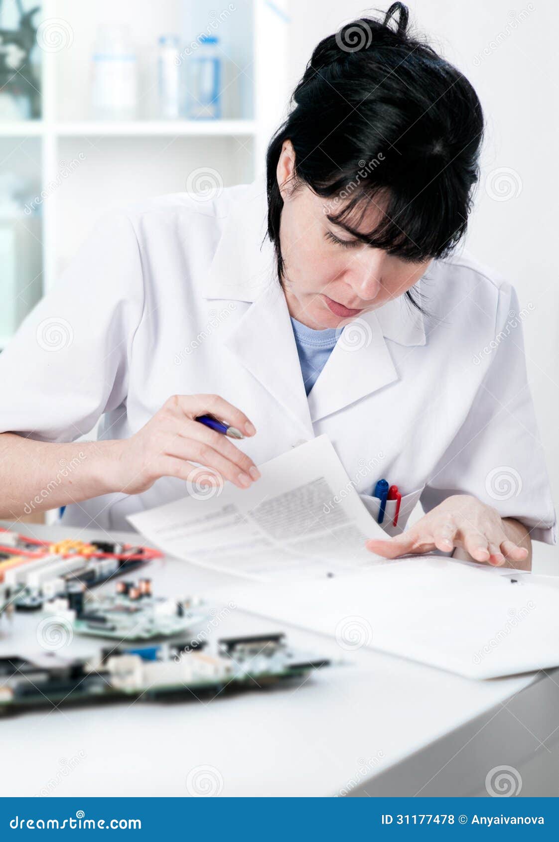 Electronics Repair Worker Reading Stock Photo - Image of paper, alone ...