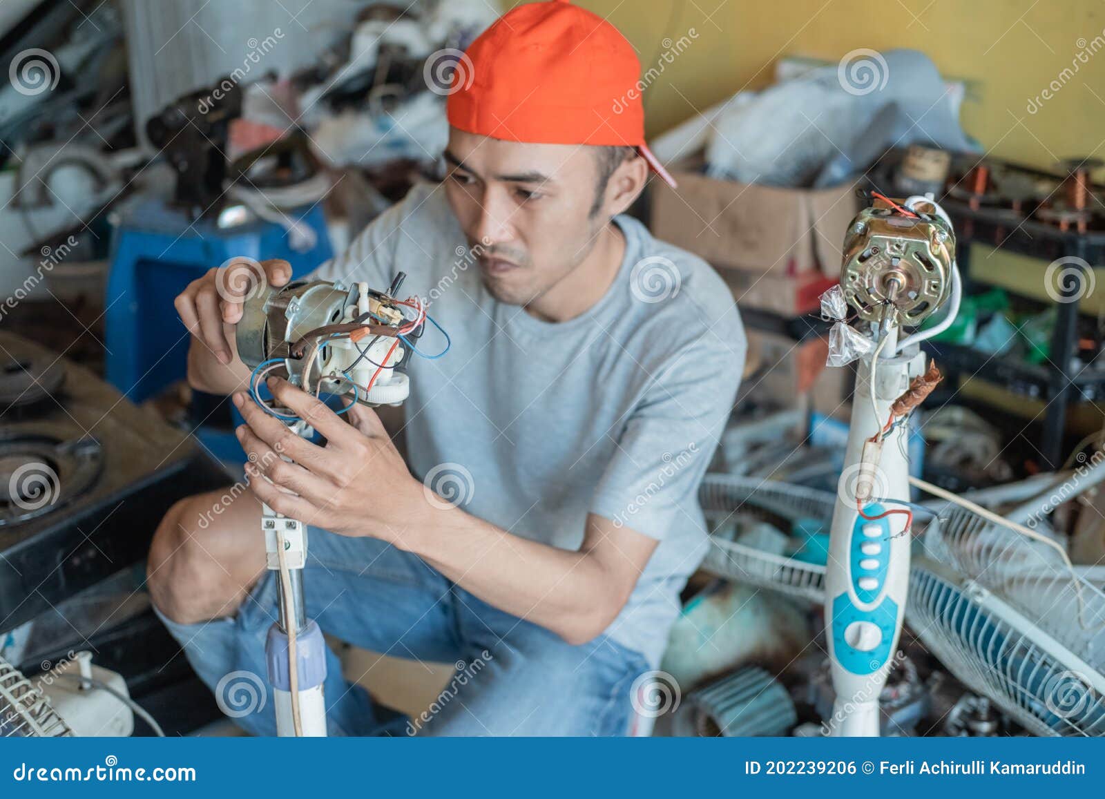 Electronics Repairman Fixes a Broken Fan Dynamo Stock Photo - Image of ...
