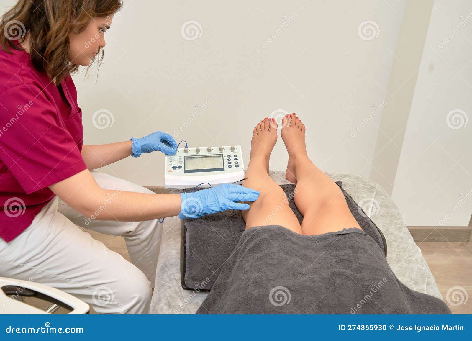 Electrotherapy Treatment on Leg by Therapist Stock Photo - Image of ...