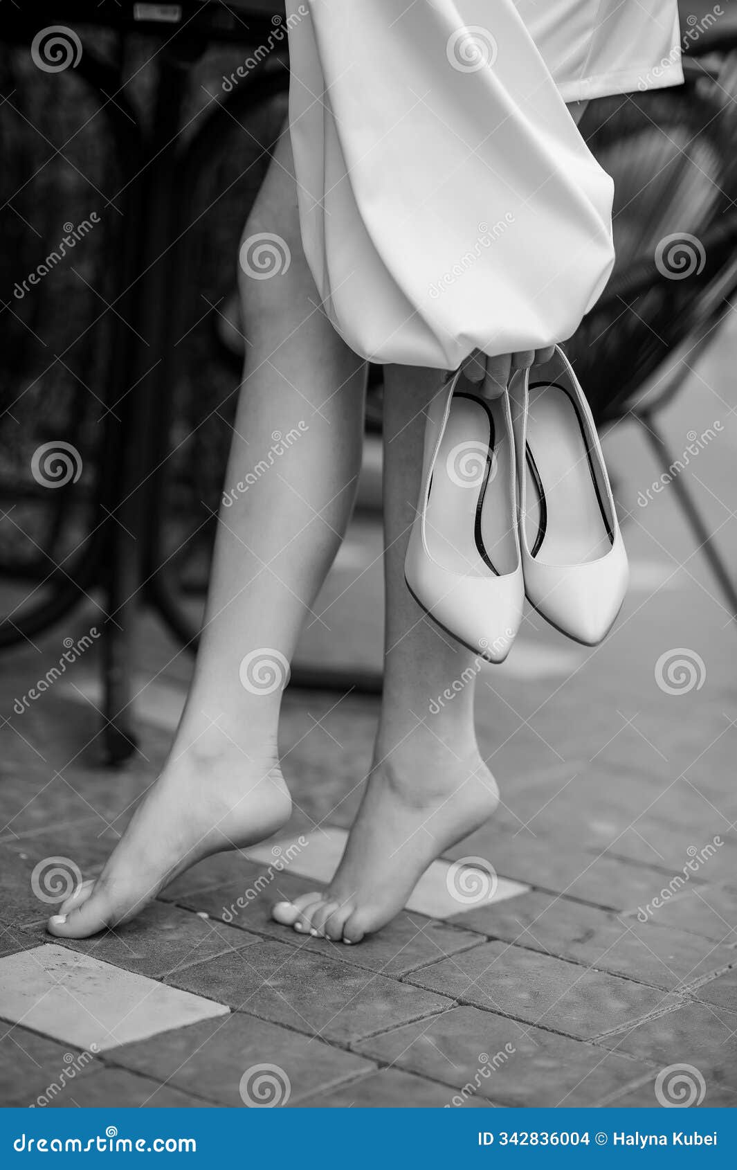 Elegant Barefoot Pose with High Heels in Monochrome Setting Stock Photo ...