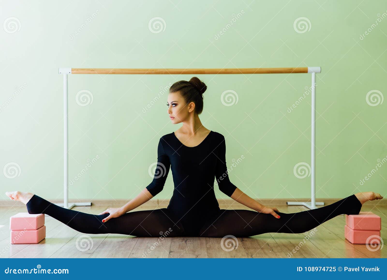 Elegant Beautiful Ballet Dancer Girl With Perfect Body Sits On The