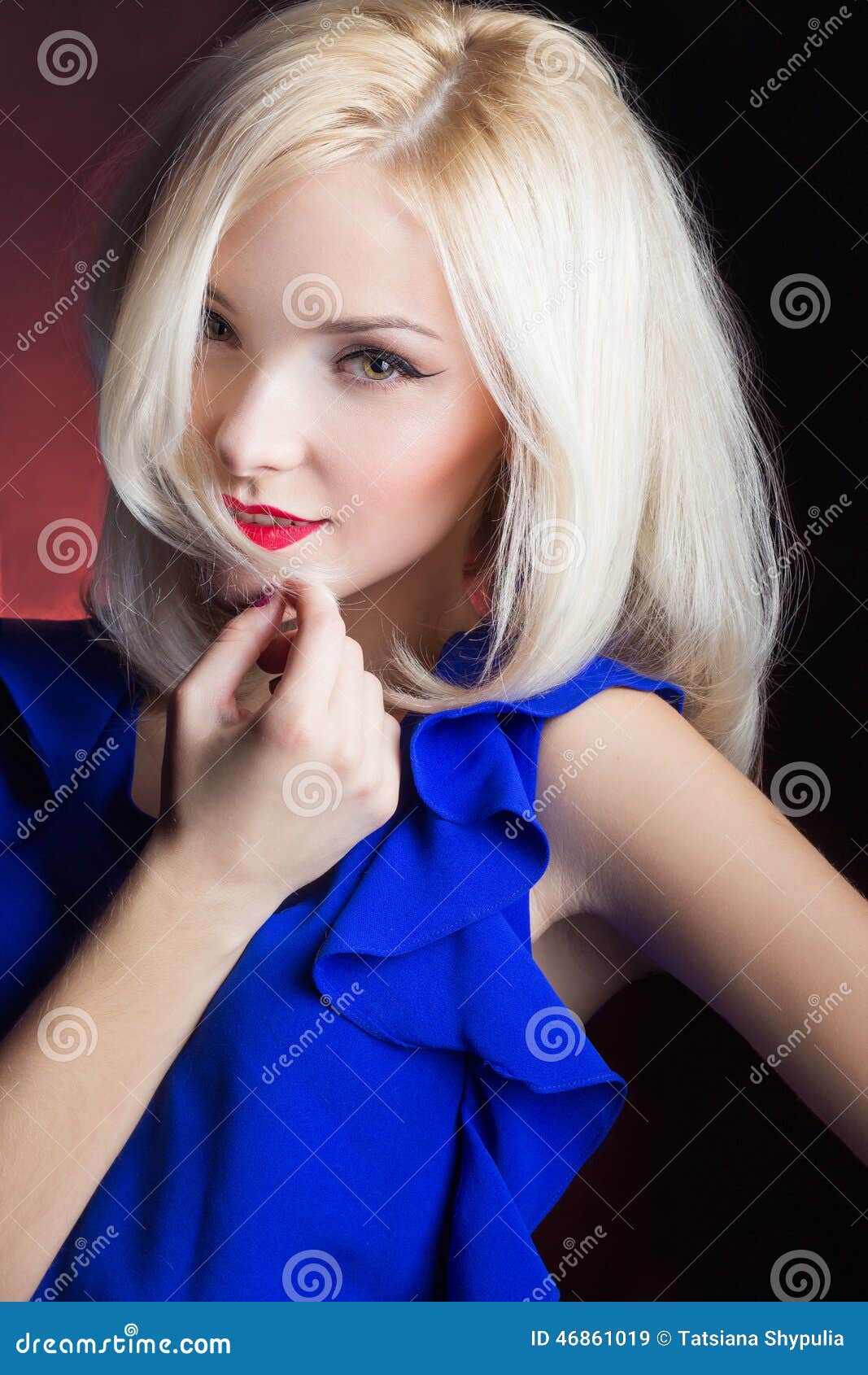 Elegant Beautiful Girl Blonde With Red Lips In A Blue Dress In The