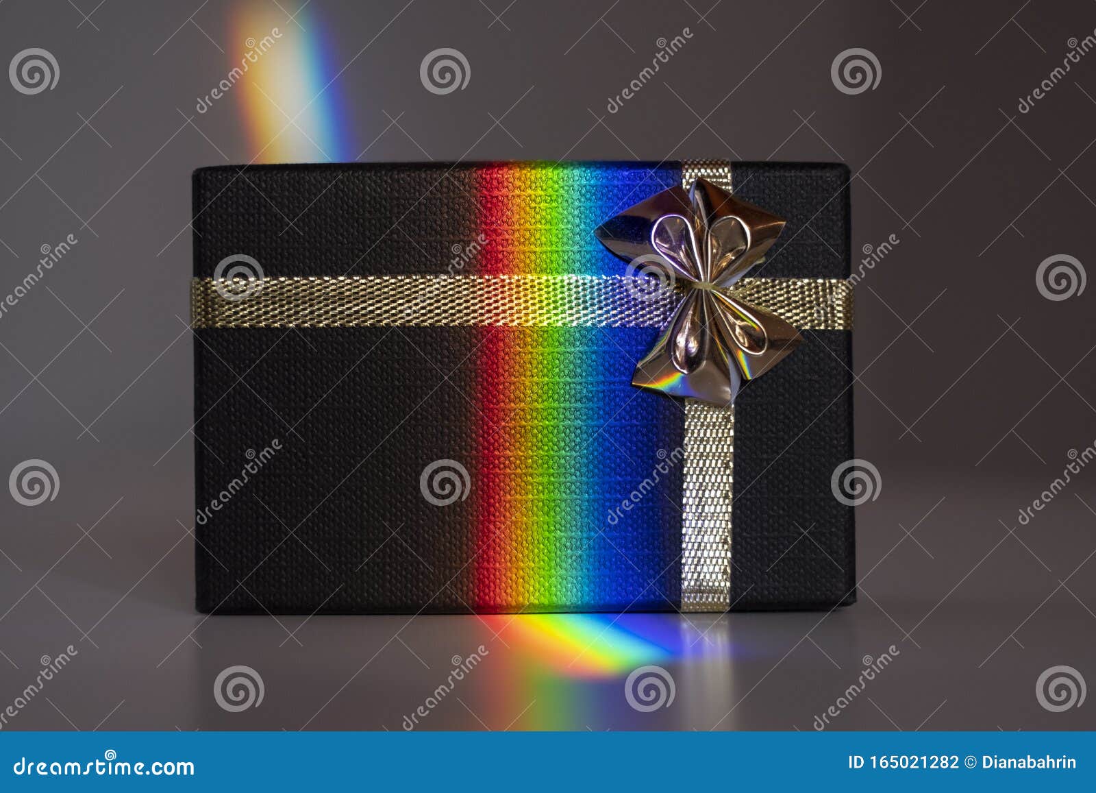 An Elegant Black Box with Golden Bow in Spectral Light. Front View ...