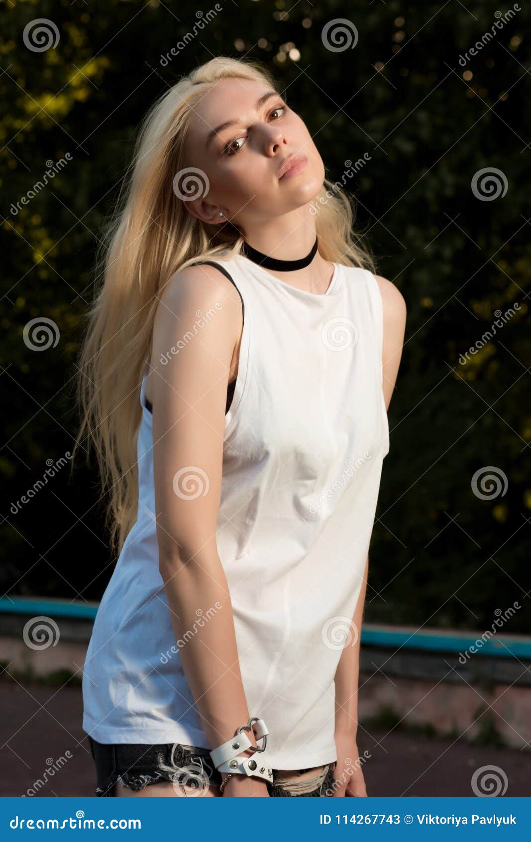Elegant Blonde Girl With Long Hair Dressed In Fashionable Clothe Stock