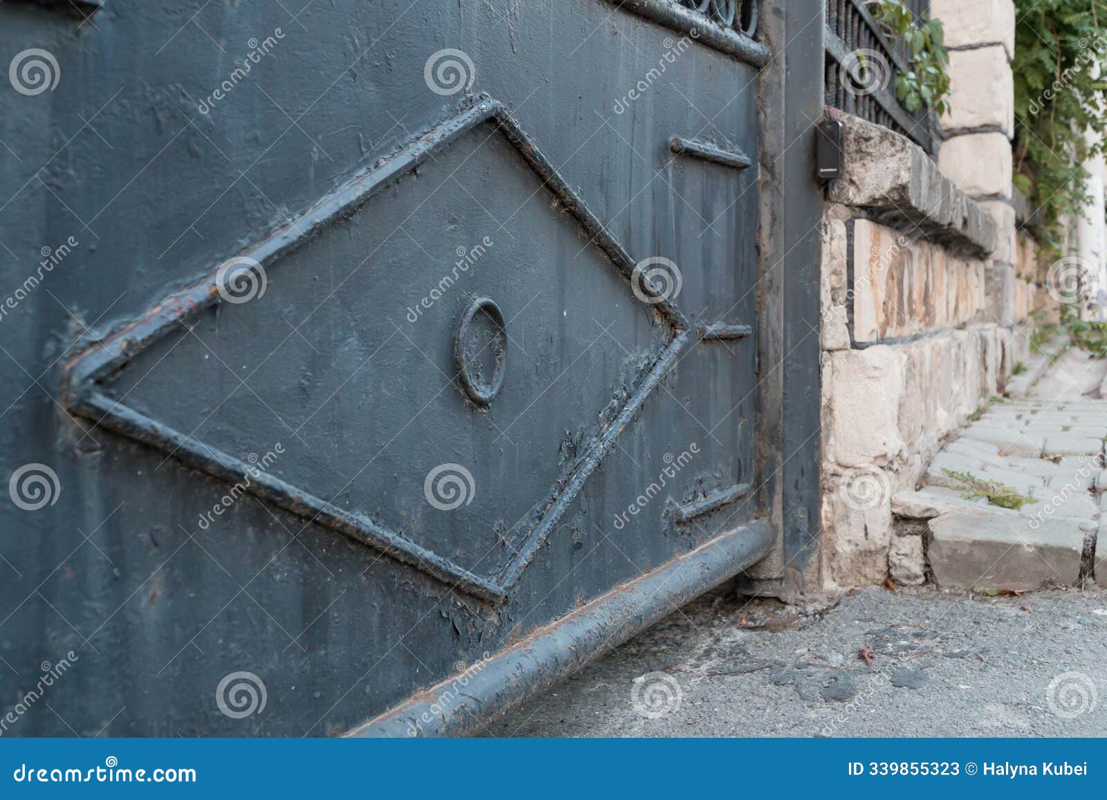 Elegant Blue Gate with Intricate Design in Quaint Stone Pathway Stock ...