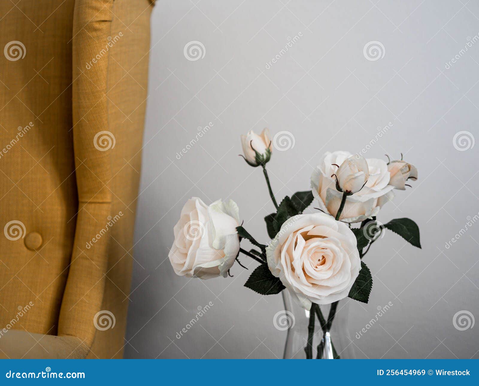 Elegant Brown Couch with a Vase of White Roses on a Table Stock Image ...