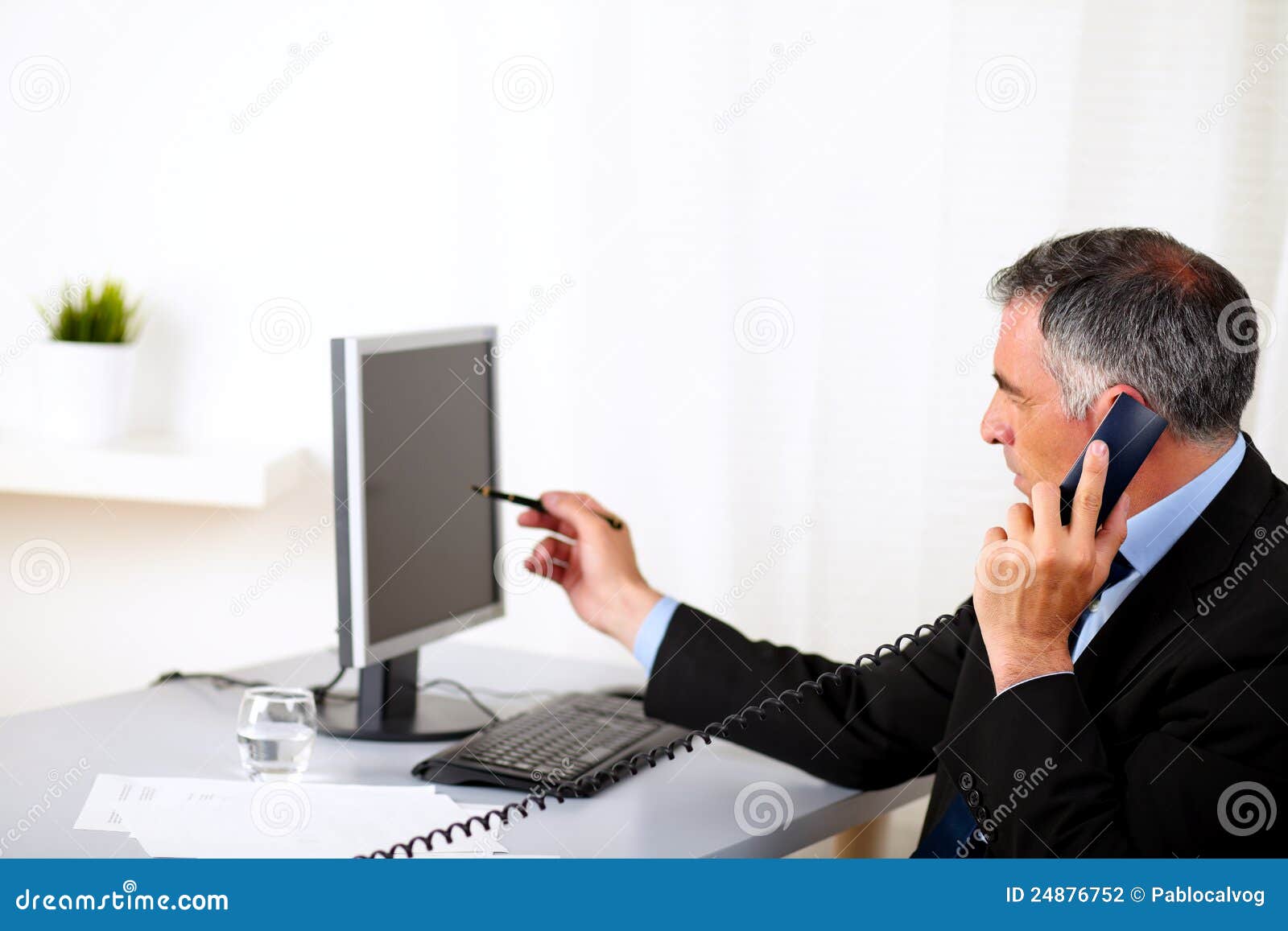Elegant Businessman Pointing the Computer Stock Photo - Image of ...