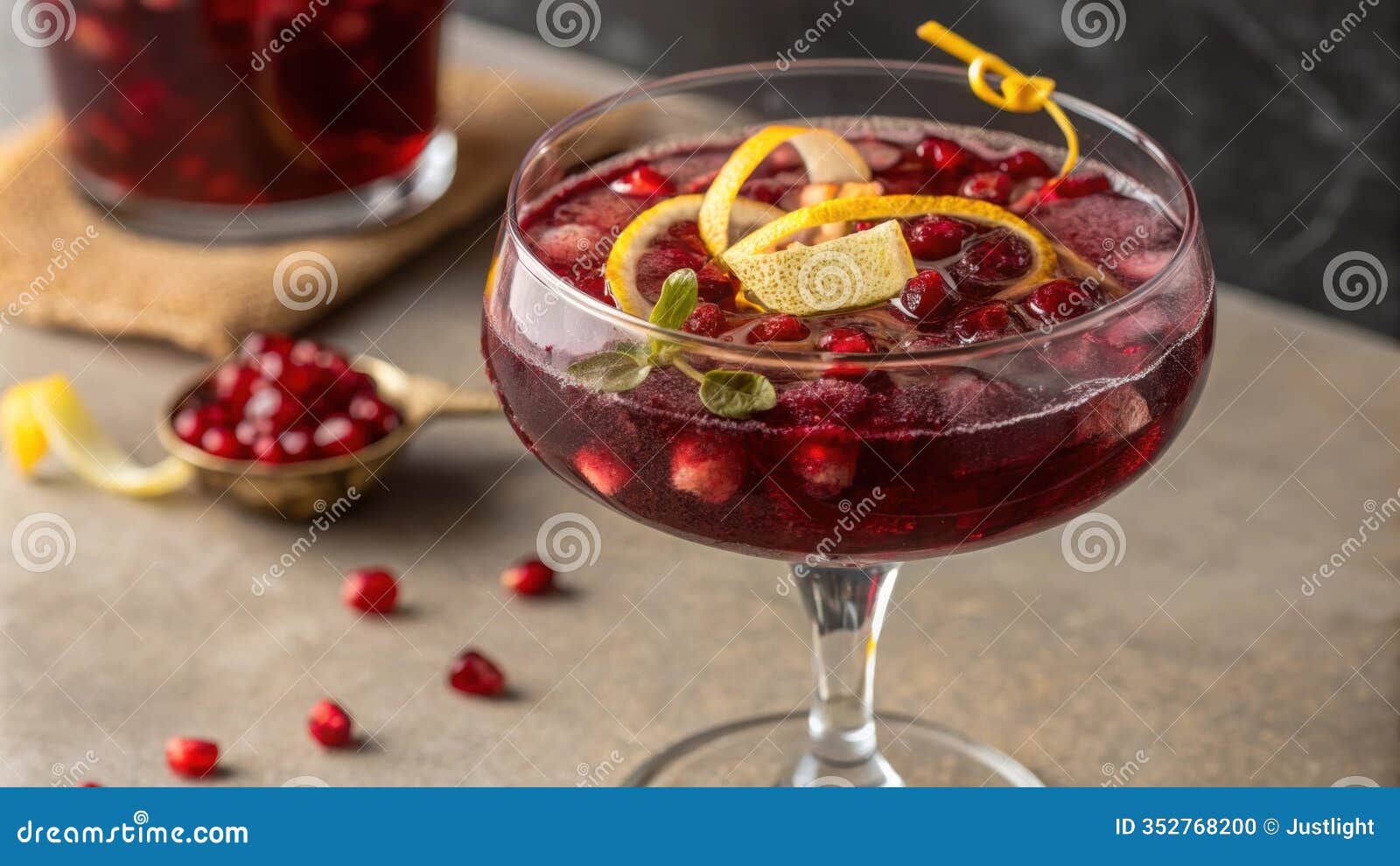 An Elegant Chalice B with a Deep Ruby Elixir. the Drink is Infused with Small Pieces of Vibrant ...