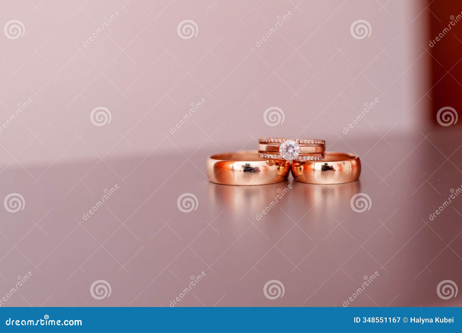 Elegant Display of Wedding Rings on a Reflective Surface Stock Image ...