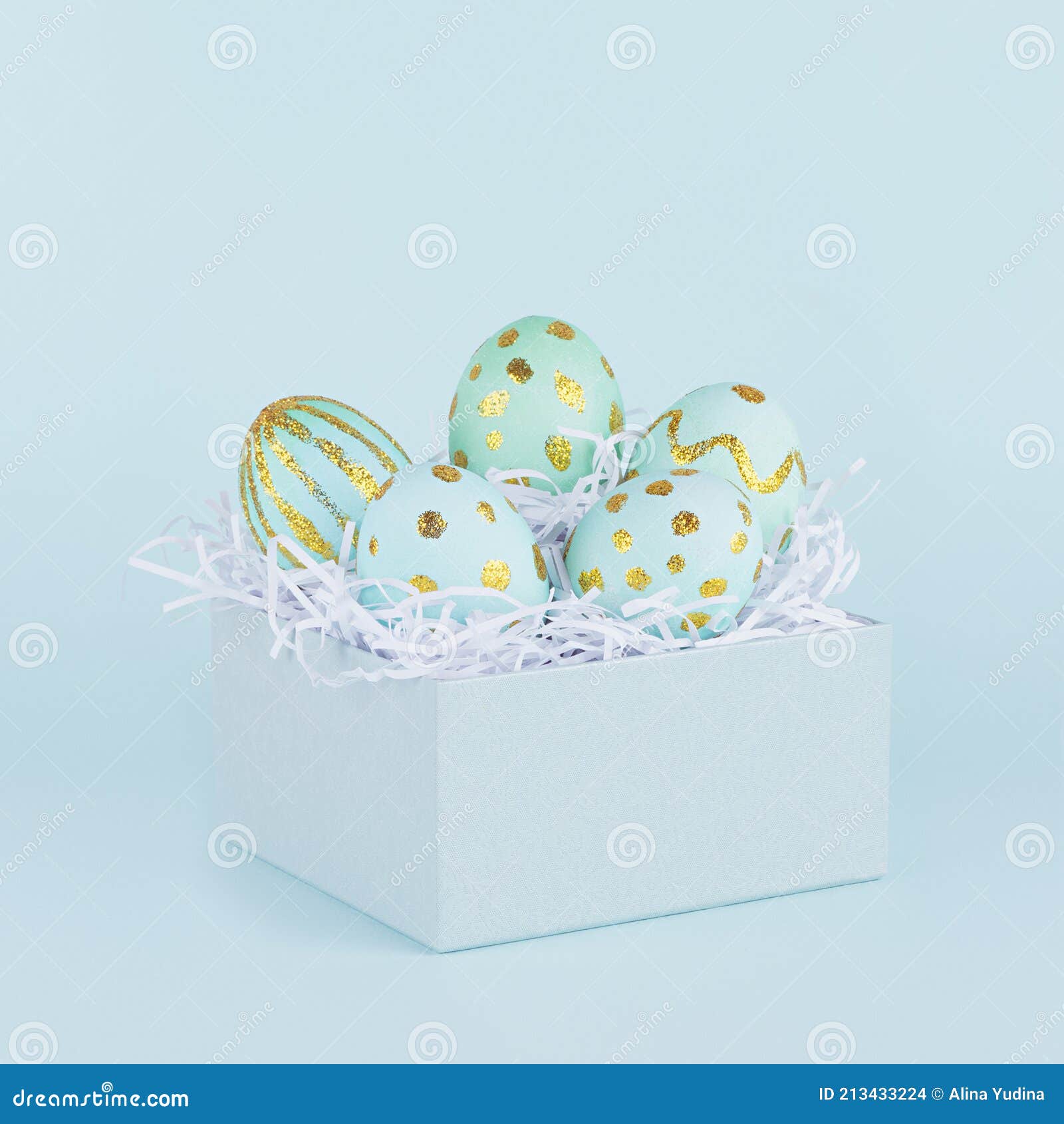 Elegant Easter Eggs with Gold Design in Gift Box on Blue Background ...