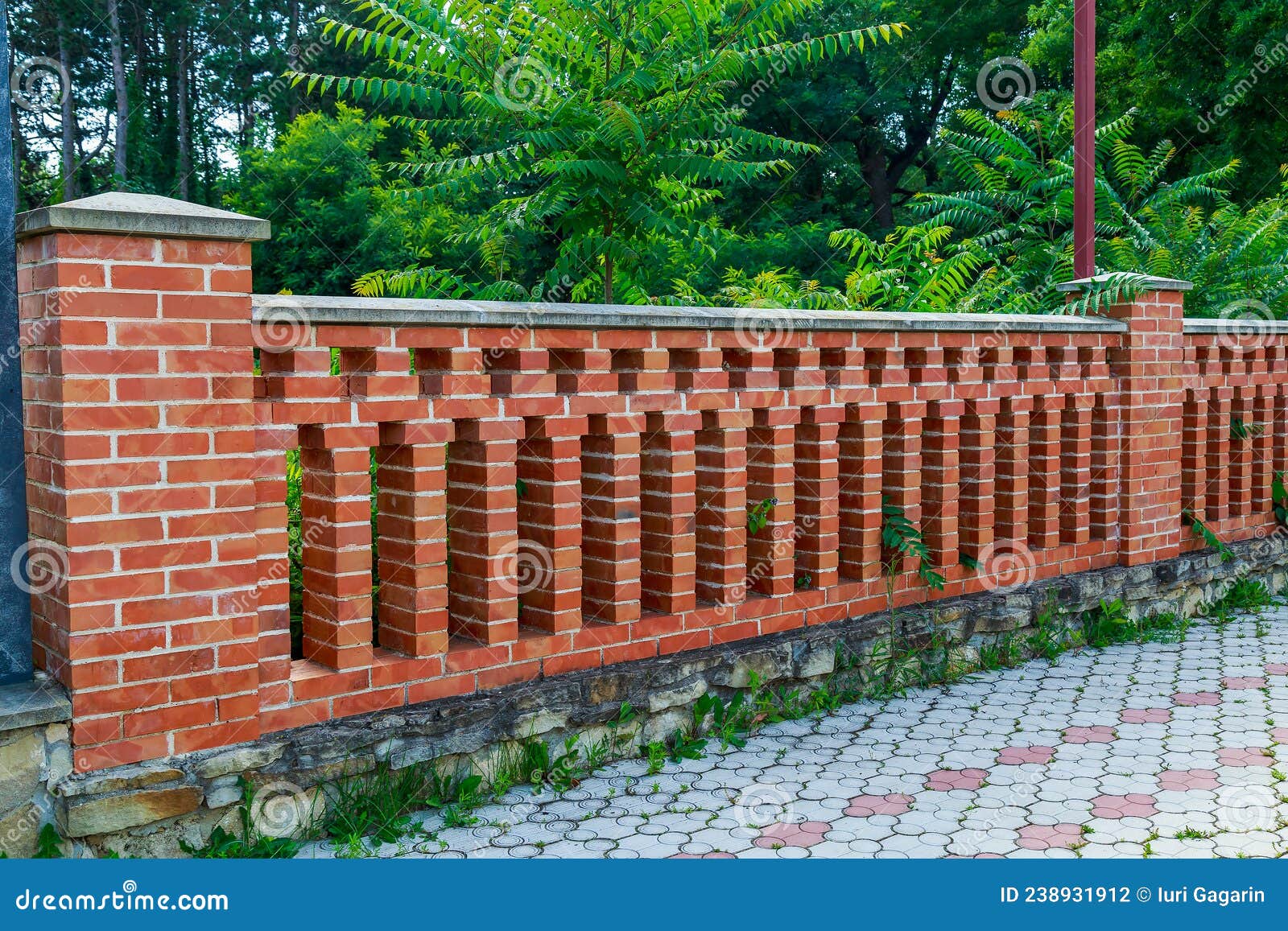 An Elegant Fence Made of Brick Columns. Background with Copy Space for ...