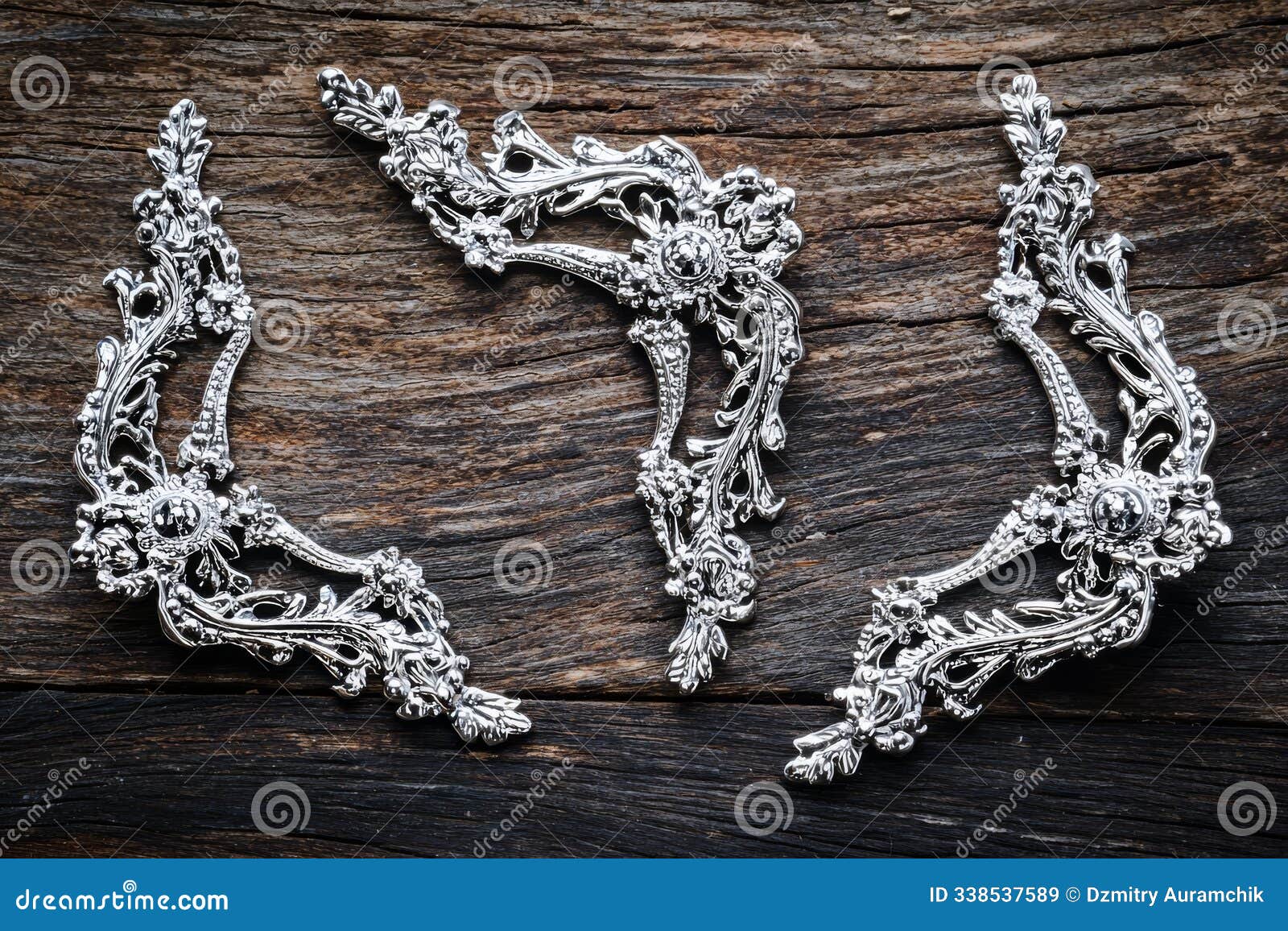 An Elegant Frame Made of Silver Stucco Plaster Lying on a Dark Wood ...