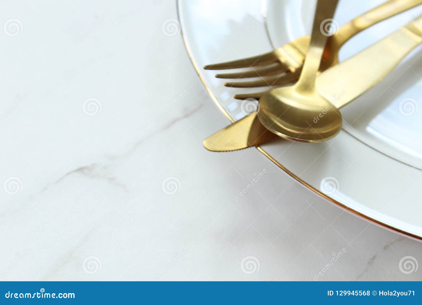 Golden fine dining stock photo. Image of silverware - 129945568
