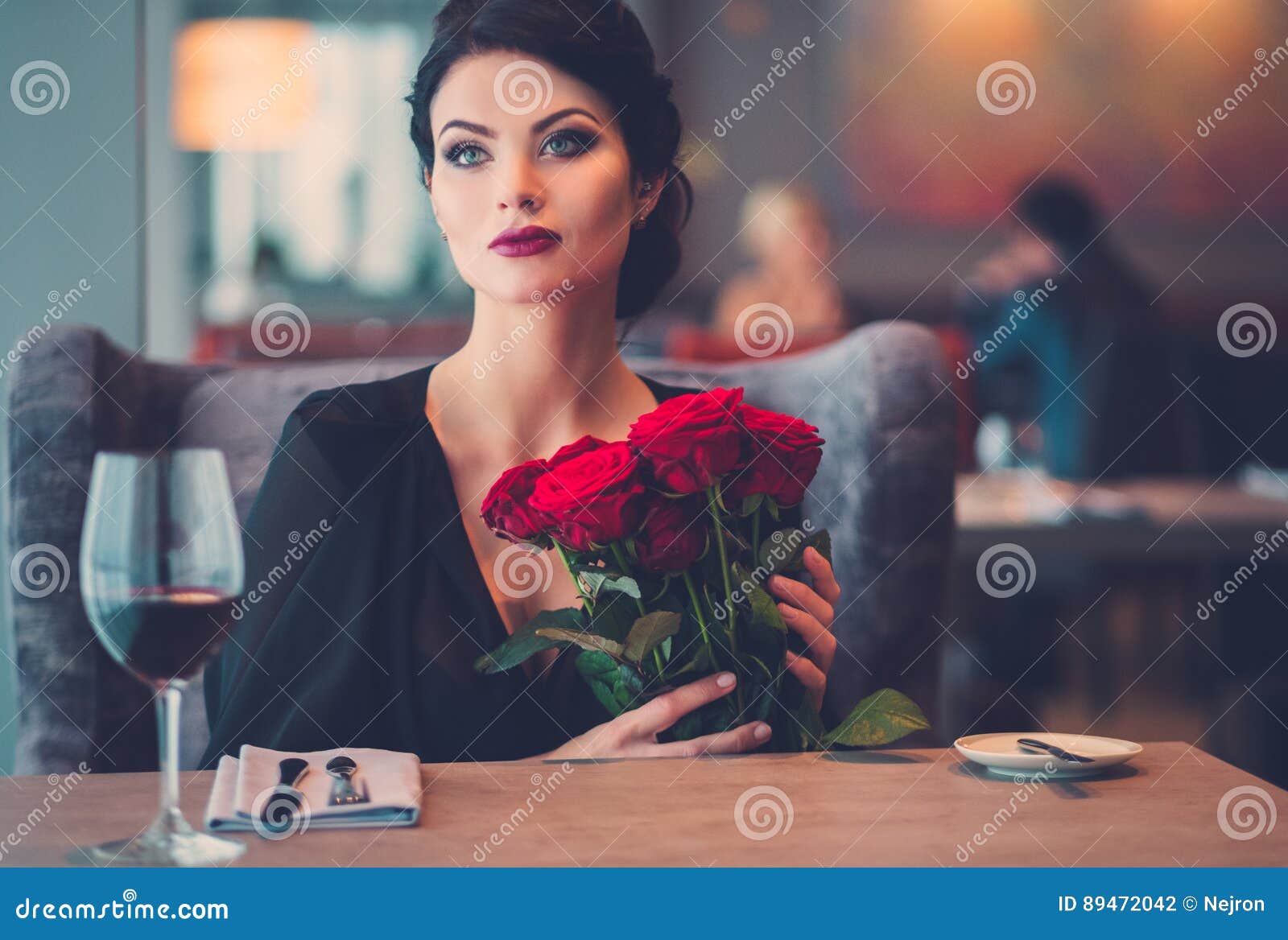 Elegant Lady with Red Roses in Restaurant Stock Photo - Image of ...