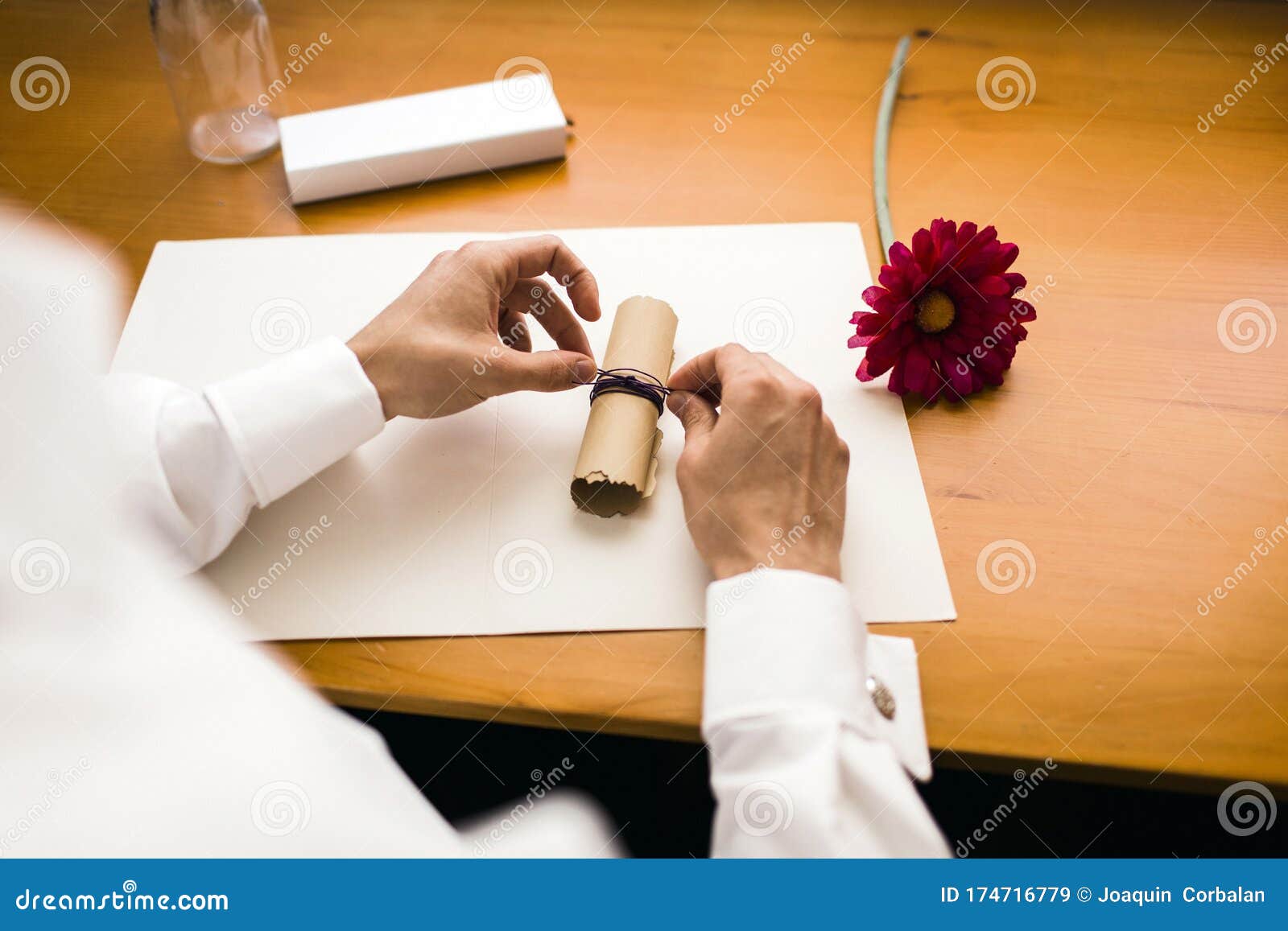 Elegant Man Knots a Roll of Paper with a Message To Put it in a Bottle ...