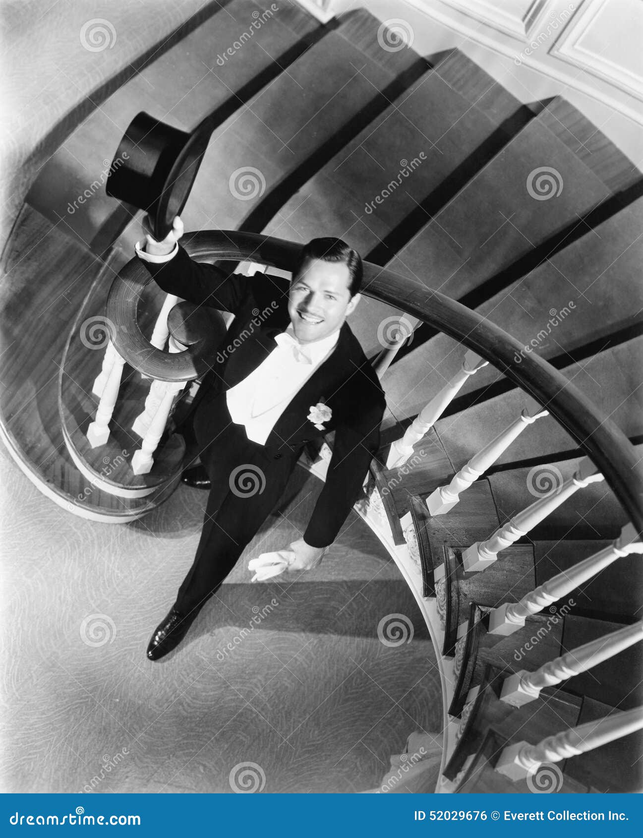 Elegant Man Looking Up from the Bottom of a Staircase Stock Photo ...