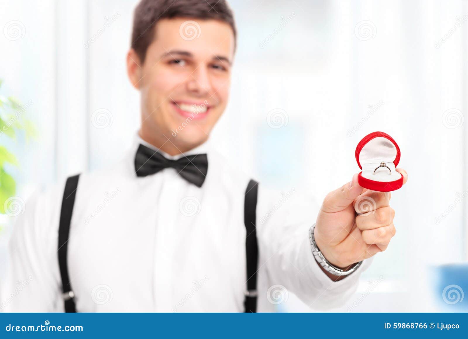 Elegant Man Proposing with an Engagement Ring Stock Photo - Image of ...