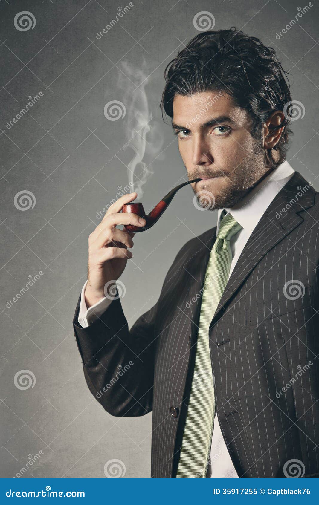 Elegant Man Smoking With A Pipe Royalty Free Stock Photo - Image: 35917255