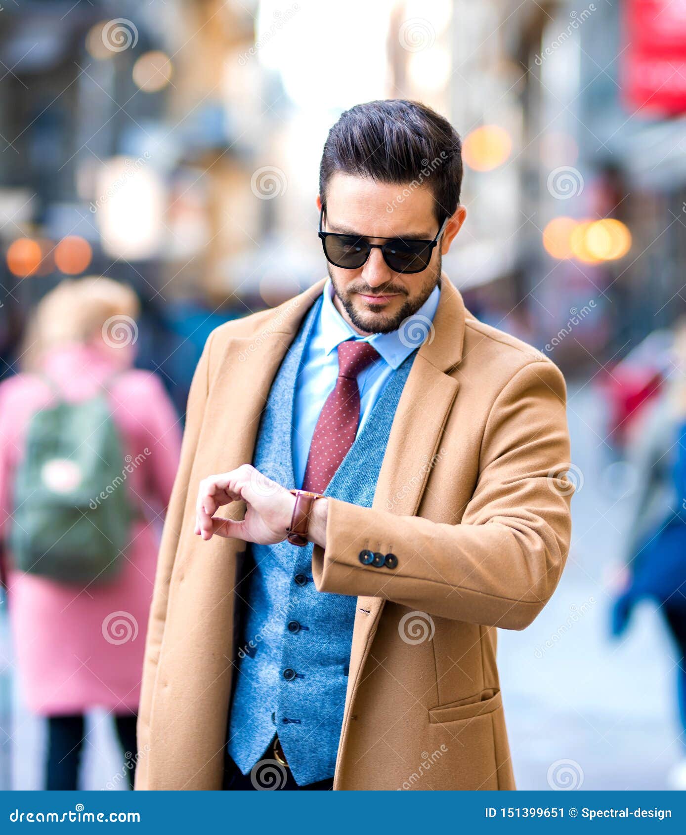 An Elegant Man Walking on the Streets and Checking the Time Stock Image ...