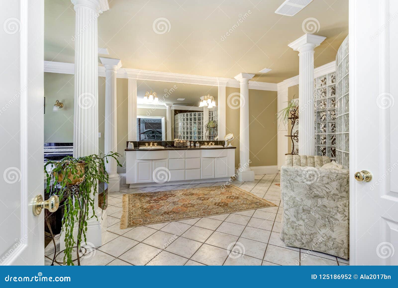 Elegant Master Bathroom with White Columns Stock Photo - Image of ...