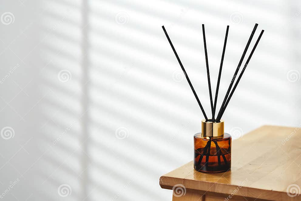 Elegant Reed Diffusers on Wooden Surface with Soft Background Light Stock Image - Image of light ...