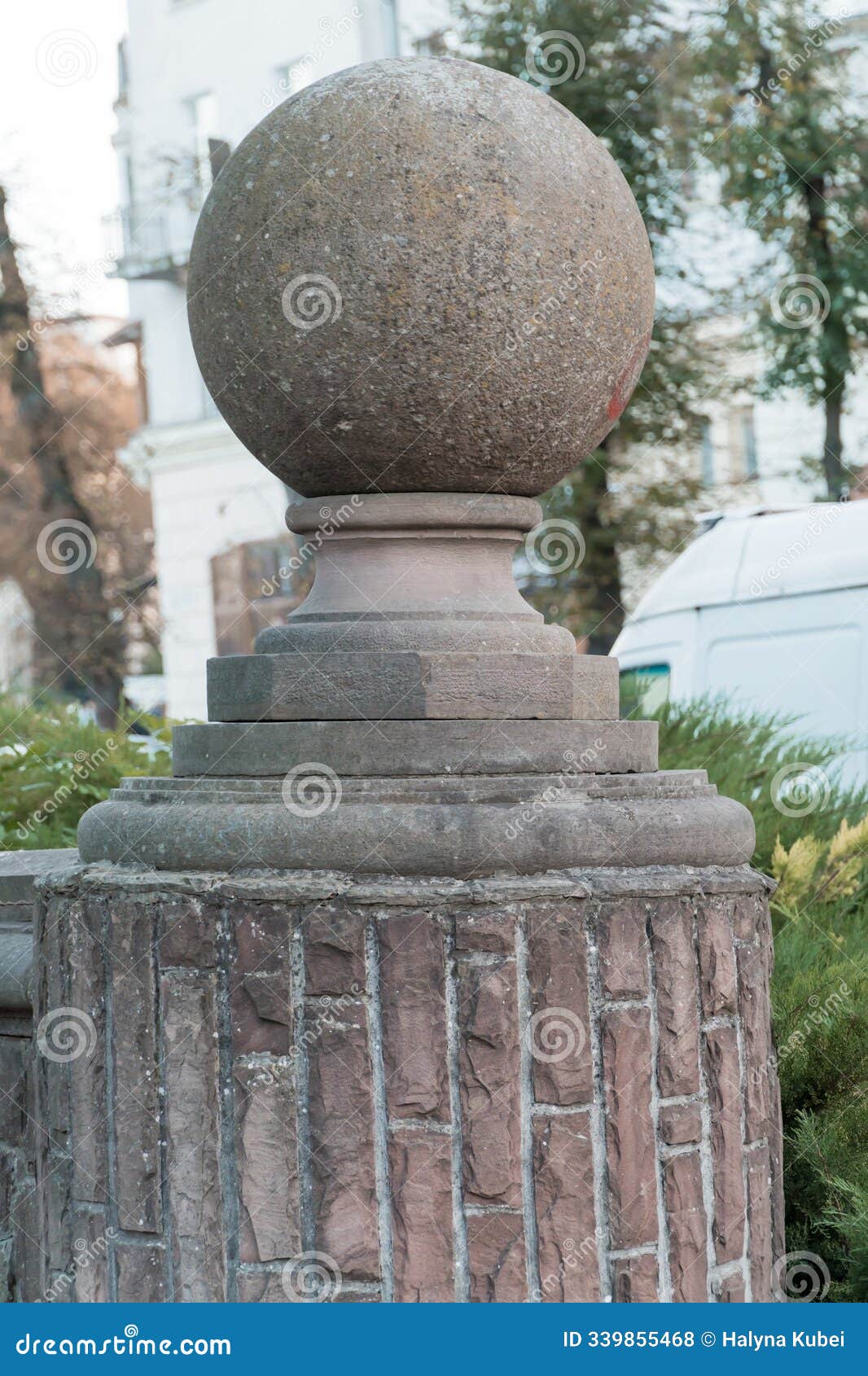 Elegant Stone Sphere Atop Decorative Column in Urban Park Setting Stock ...
