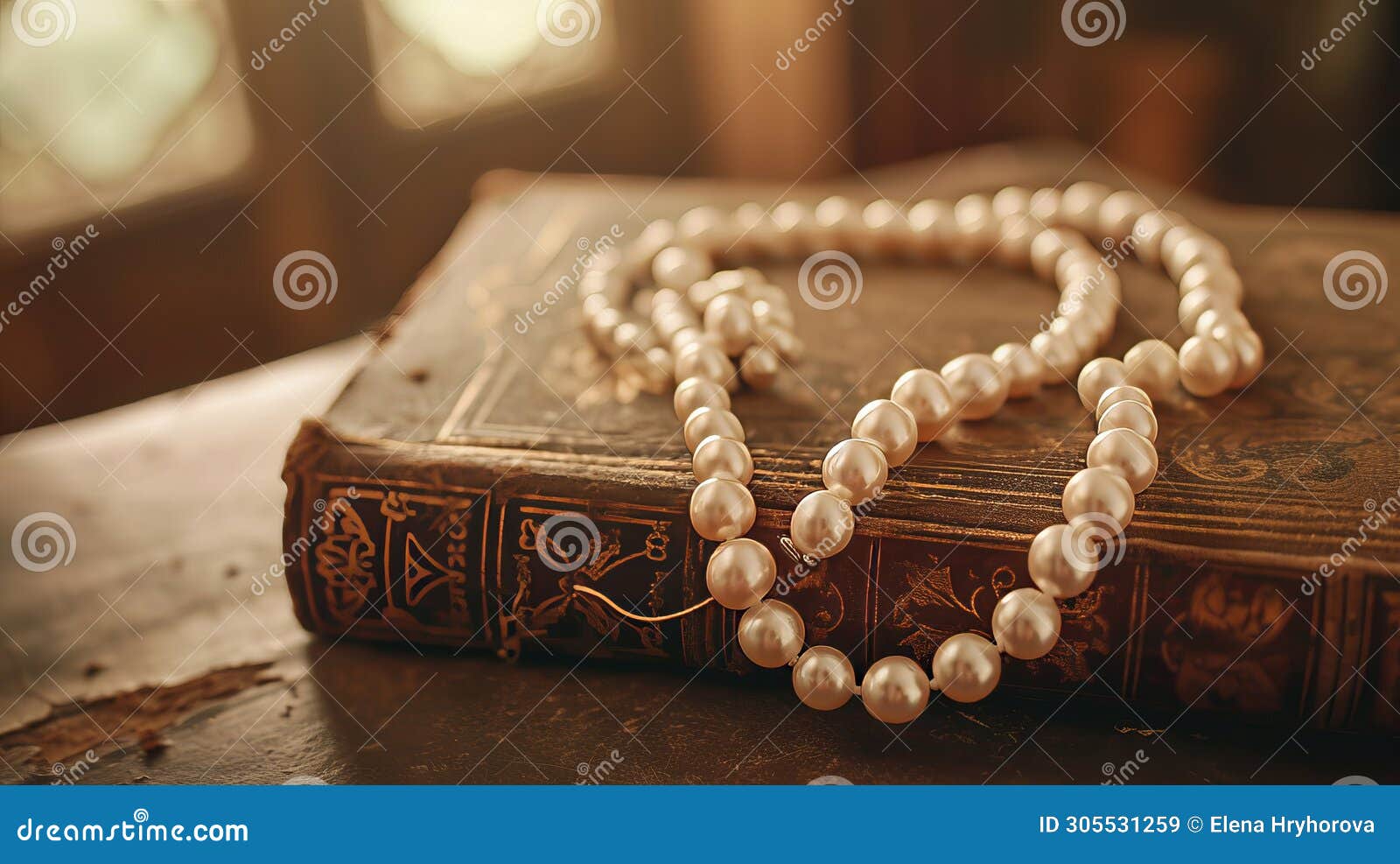 Elegant String of Pearls Draped Over a Vintage Embossed Leather Book ...