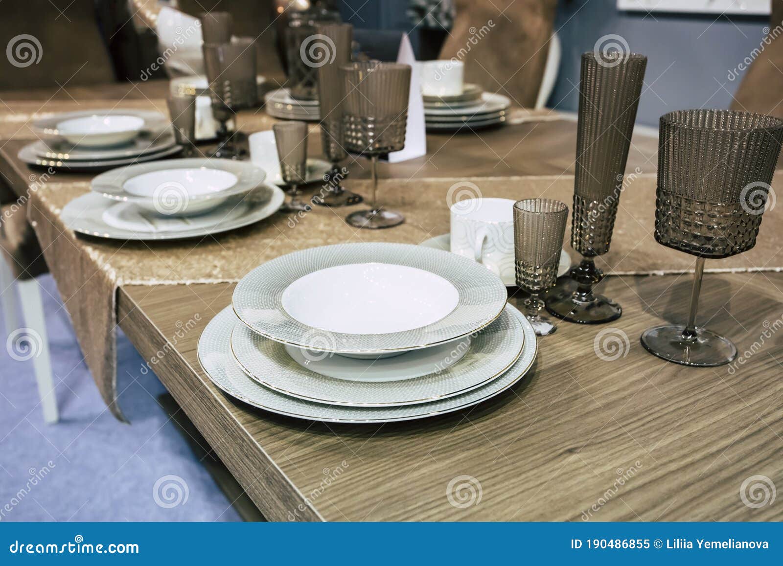 Elegant Table Appointments with Classic Plates and Retro Glasses Ready ...
