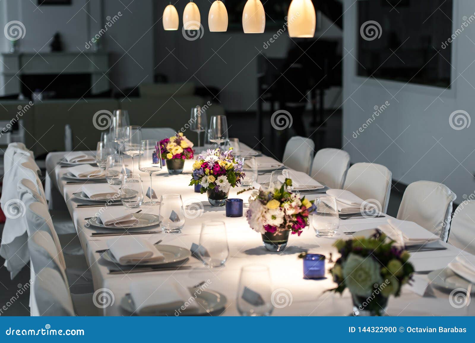 Elegant Table Setting with Light Spots and Flowers Stock Photo - Image ...