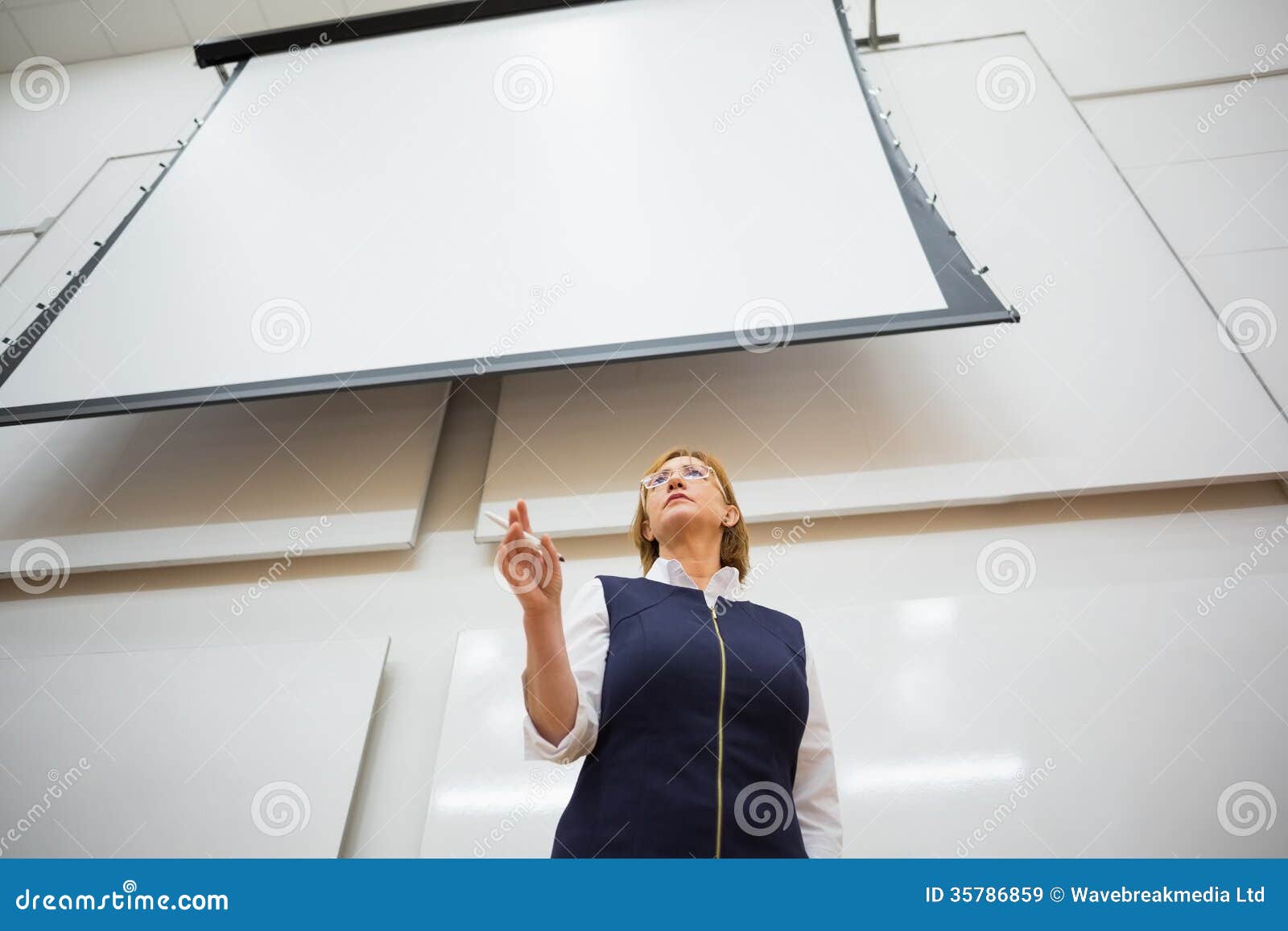 Elegant Teacher with Projection Screen in the Lecture Hall Stock Image ...