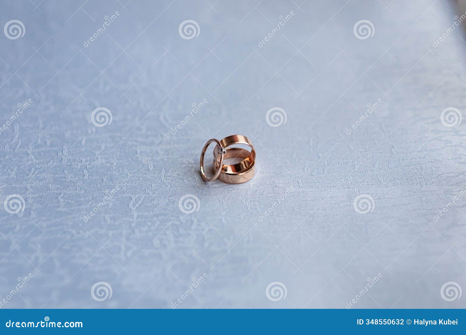 Elegant Twin Wedding Rings on Soft Blue Background Stock Photo - Image ...