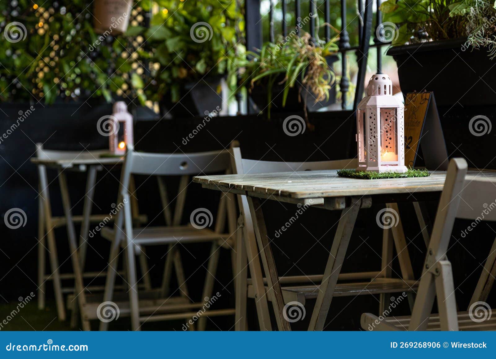 Elegant White Lantern on a Wooden Table in a Restaurant Stock Photo ...