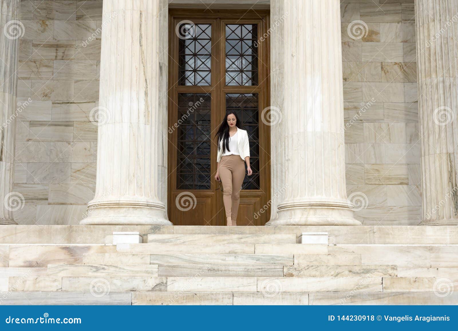 Elegant Woman while Exiting Building Stock Photo - Image of boss ...