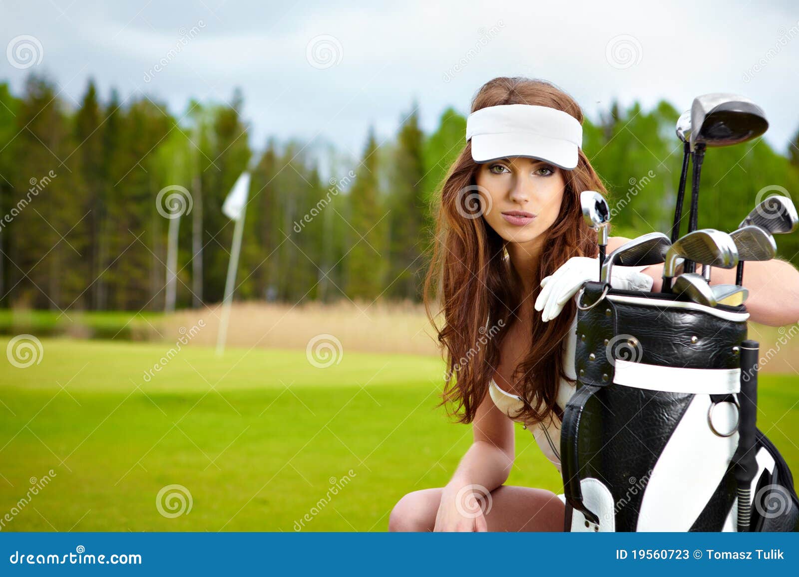 Elegant woman playing golf stock image. Image of tree - 19560723