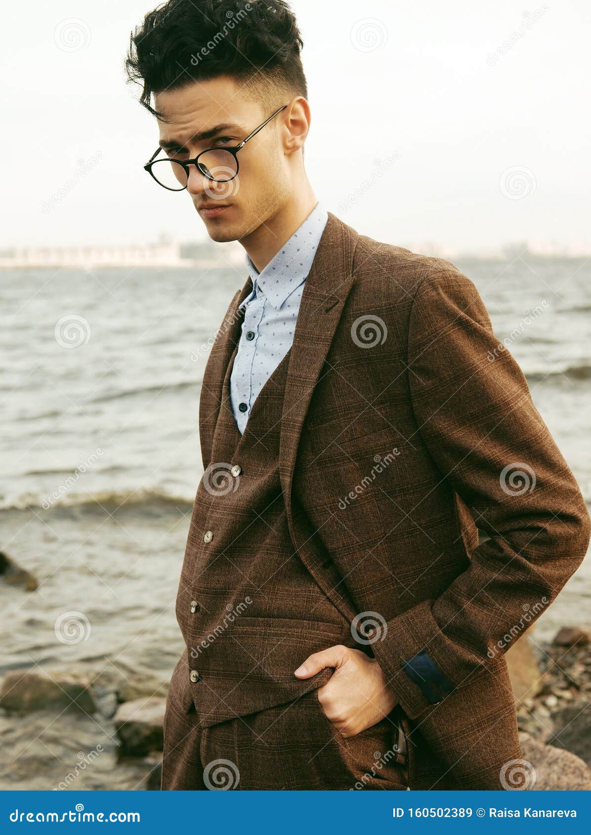Elegant Young Handsome Man Wearing Eyeglasses. Outdoors Fashion ... Elegant Young Handsome Man Wearing Eyeglasses. Outdoors Fashion ...