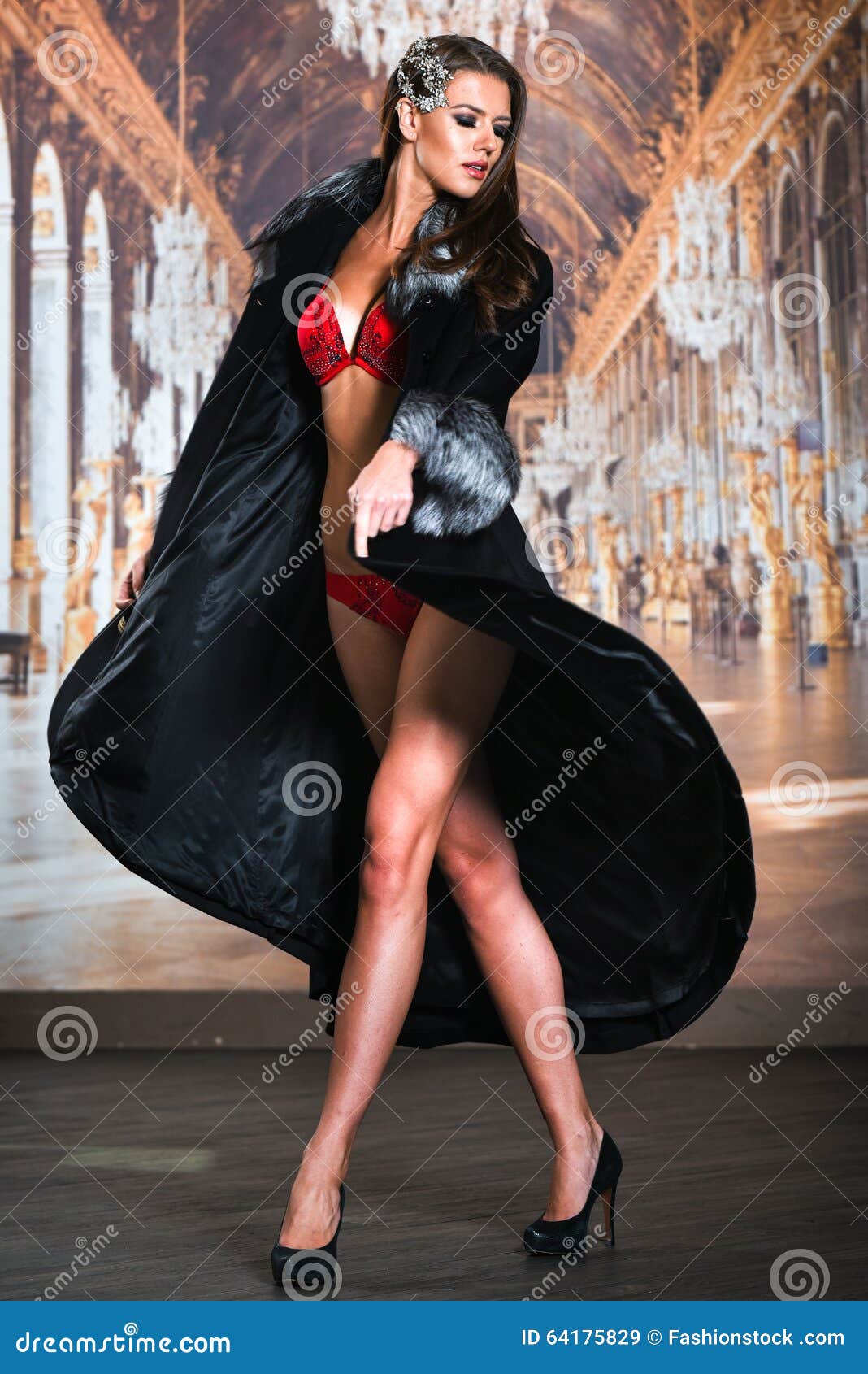 Elegant Young Woman In Seductive Red Lingerie And Luxury Fur Coat Stock