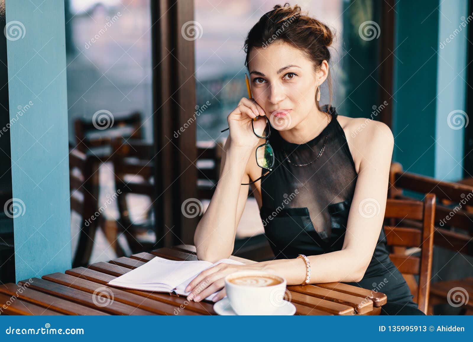 Elegant Young Woman Took Off Her Glasses While Taking A Break Of Stock