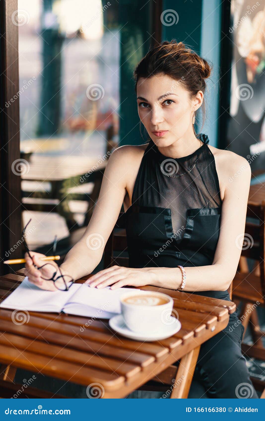 Elegant Young Woman Took Off Her Glasses While Taking A Break Of Her
