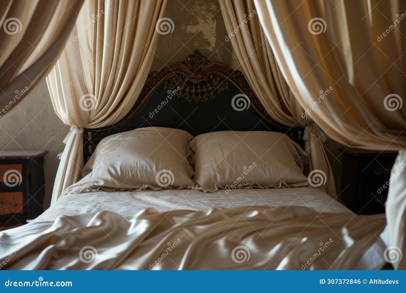 Elegantly Draped Canopy Over a Bed with Satin Bedding Stock ...